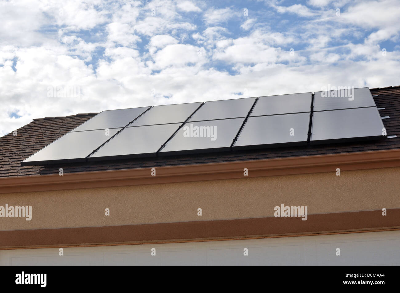 Solar Panel on Roof of New Home with Clouds and Blue Sky Stock Photo ...