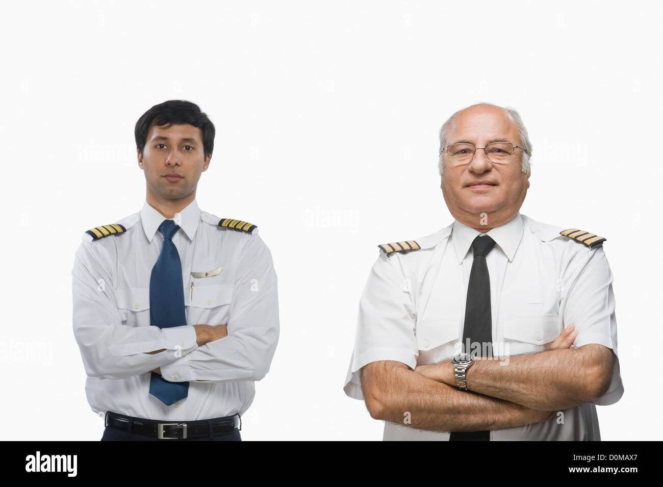 Close-up of two pilots smiling with their arms crossed Stock Photo - Alamy