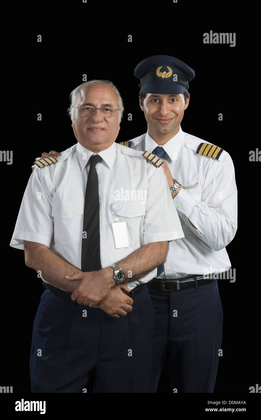 Portrait of two pilots standing together and smiling Stock Photo - Alamy