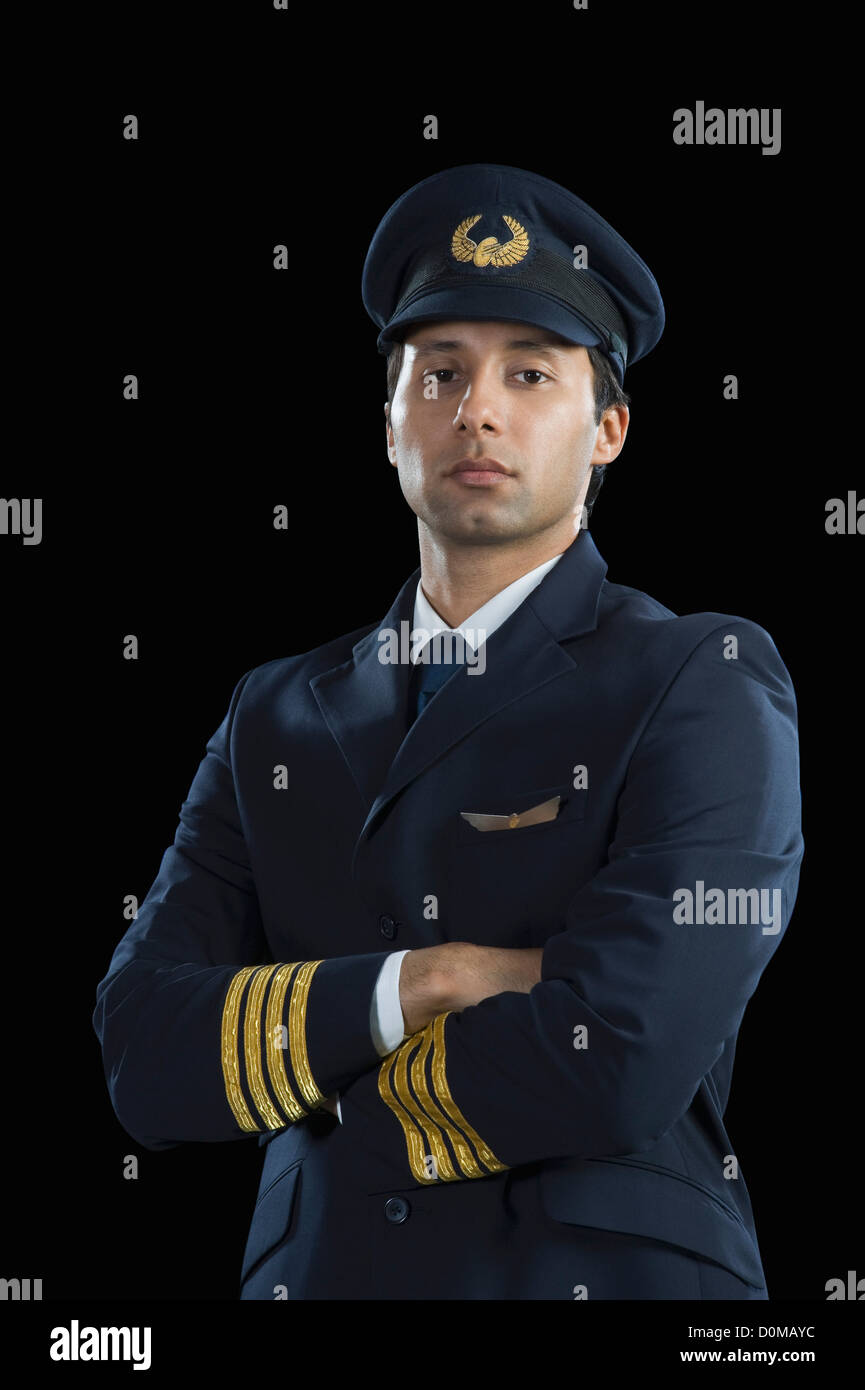 Portrait of a pilot with his arms crossed Stock Photo - Alamy