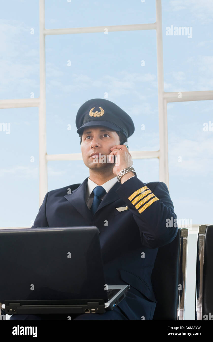Sitting looking away authority uniform hi-res stock photography and ...
