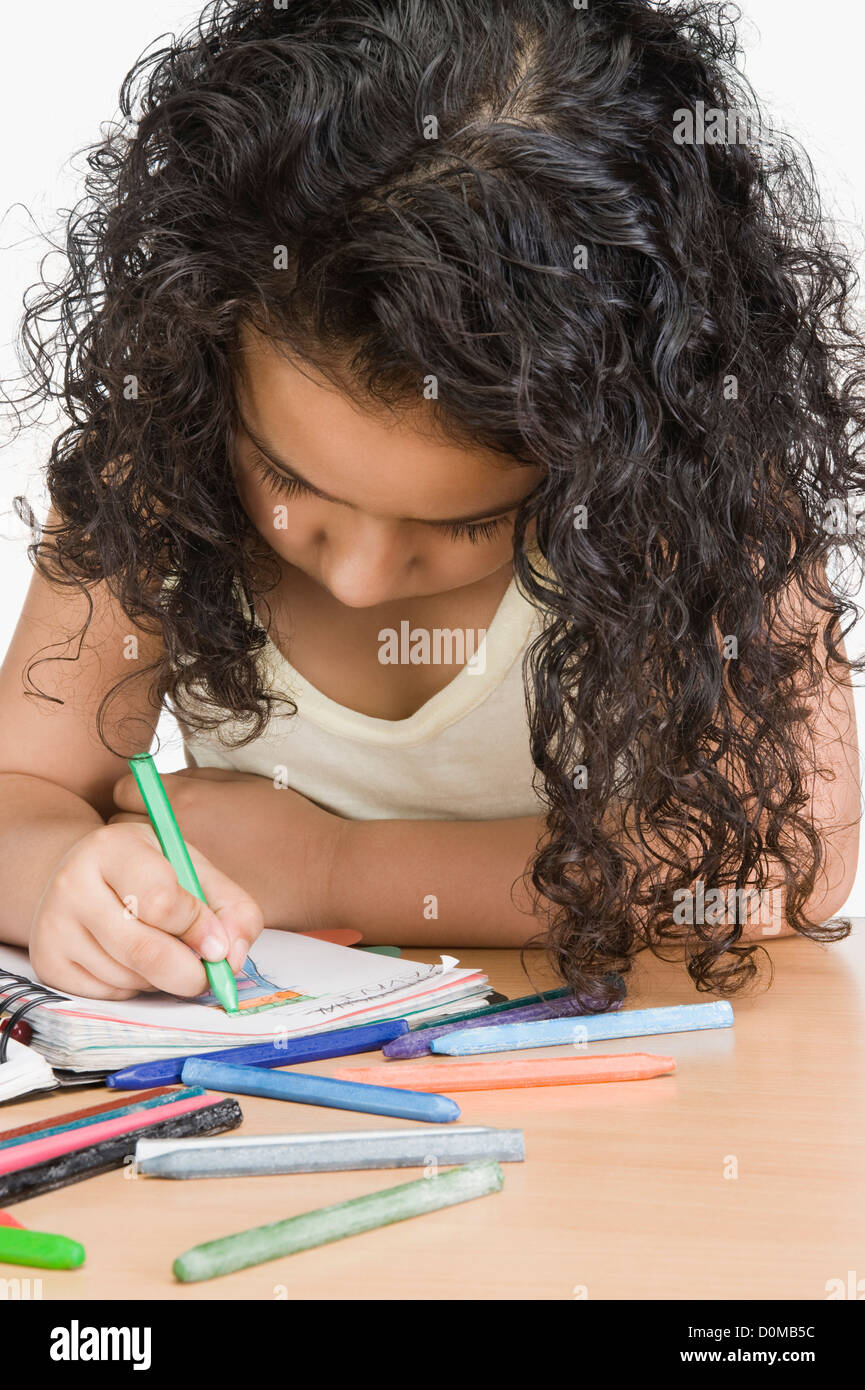 Close-up of a girl drawing a picture with crayons Stock Photo - Alamy