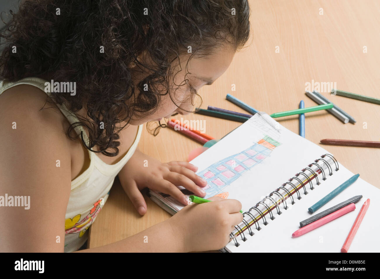 Close-up of a girl drawing a picture with crayons Stock Photo - Alamy