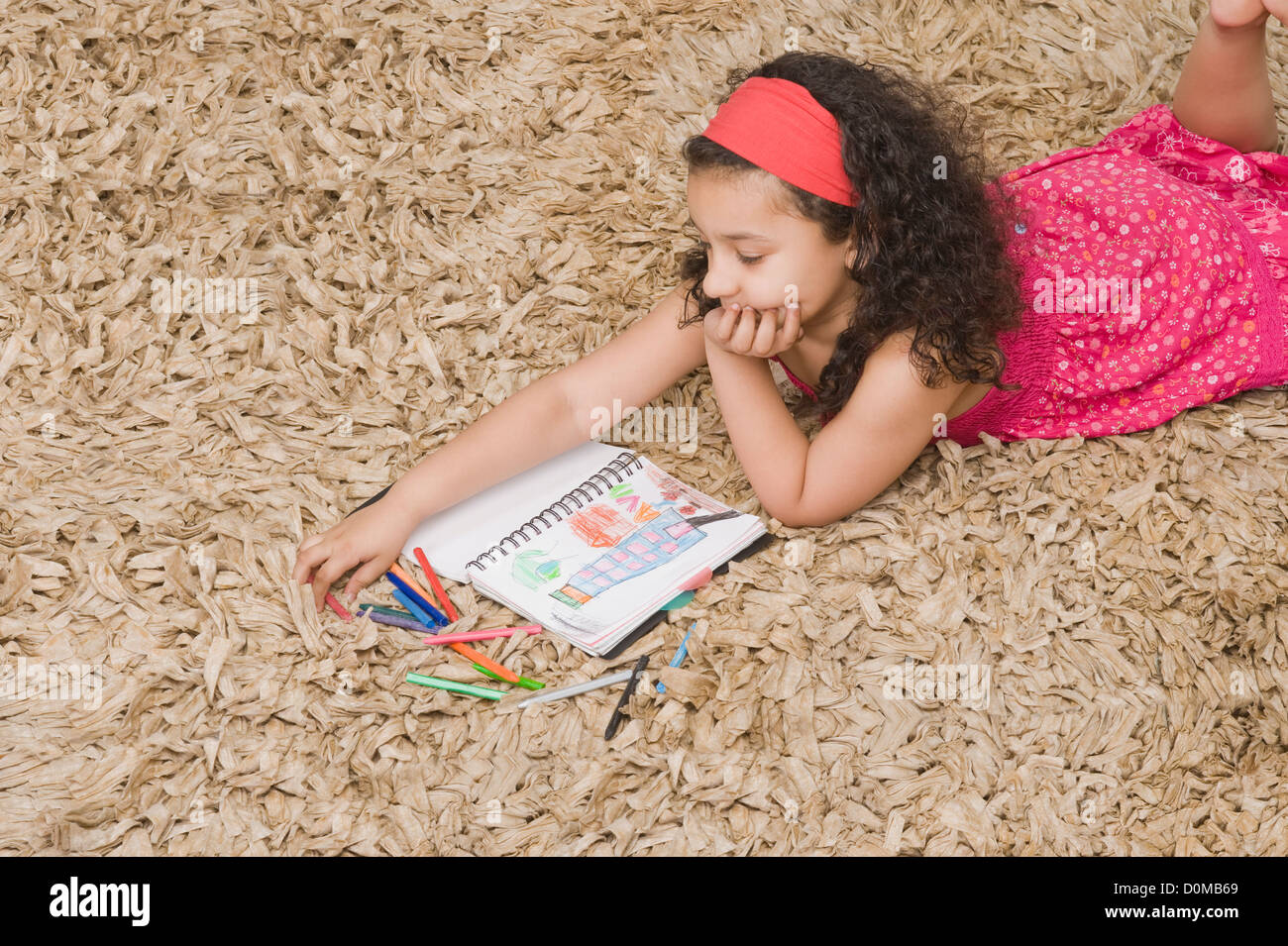 High angle view of a girl drawing a picture Stock Photo - Alamy