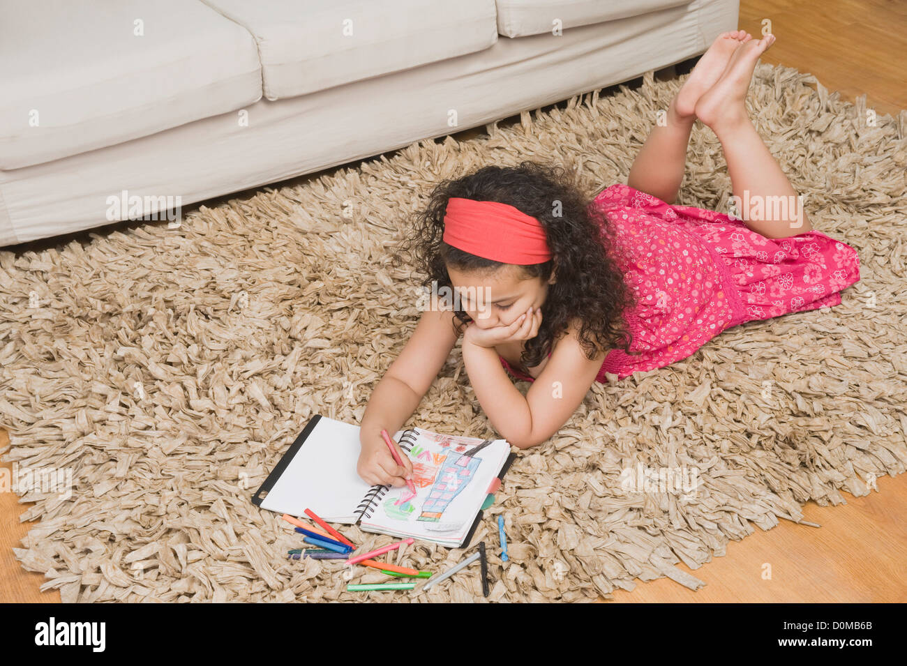 High angle view of a girl drawing a picture Stock Photo - Alamy