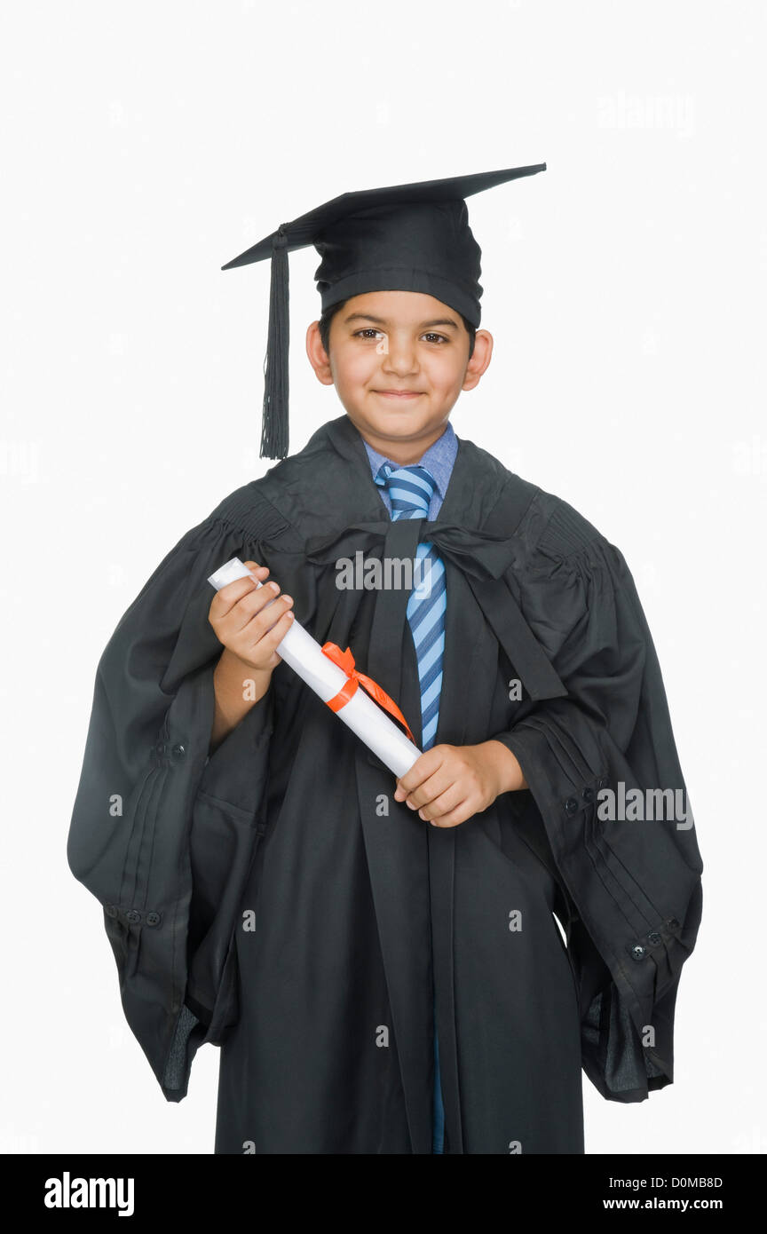 Portrait of a boy in graduation gown holding a diploma Stock Photo - Alamy