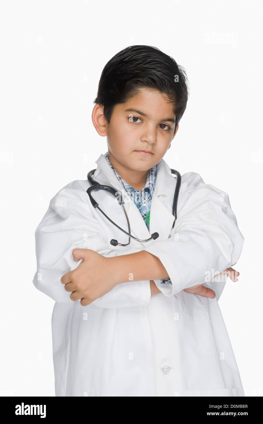 Boy looking serious in a lab coat Stock Photo - Alamy