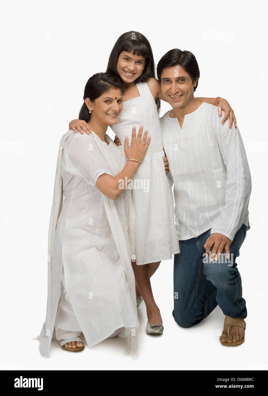 Parents smiling with their daughter Stock Photo - Alamy