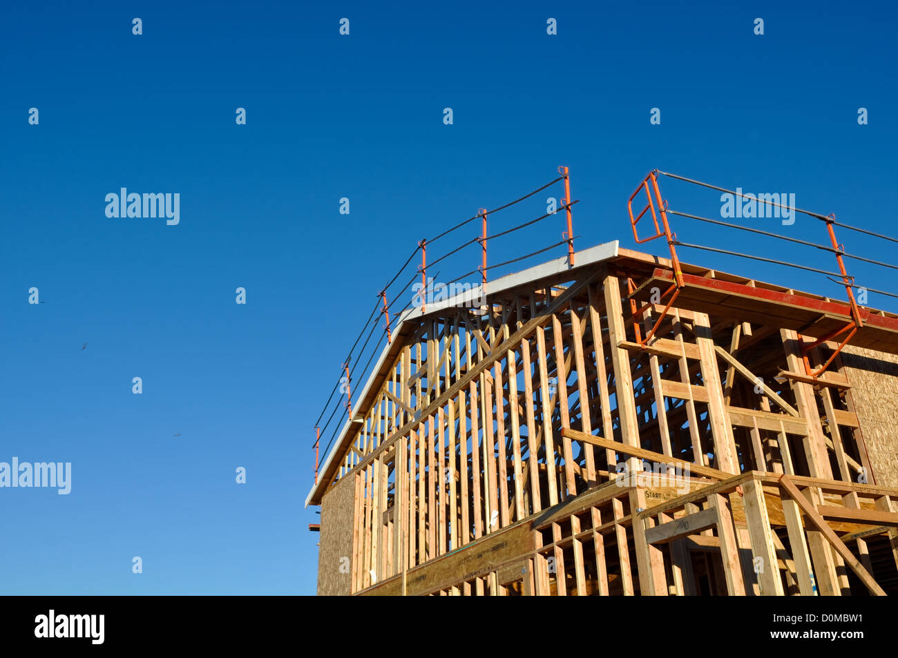 New Home Under Construction with Scaffolding Stock Photo - Alamy