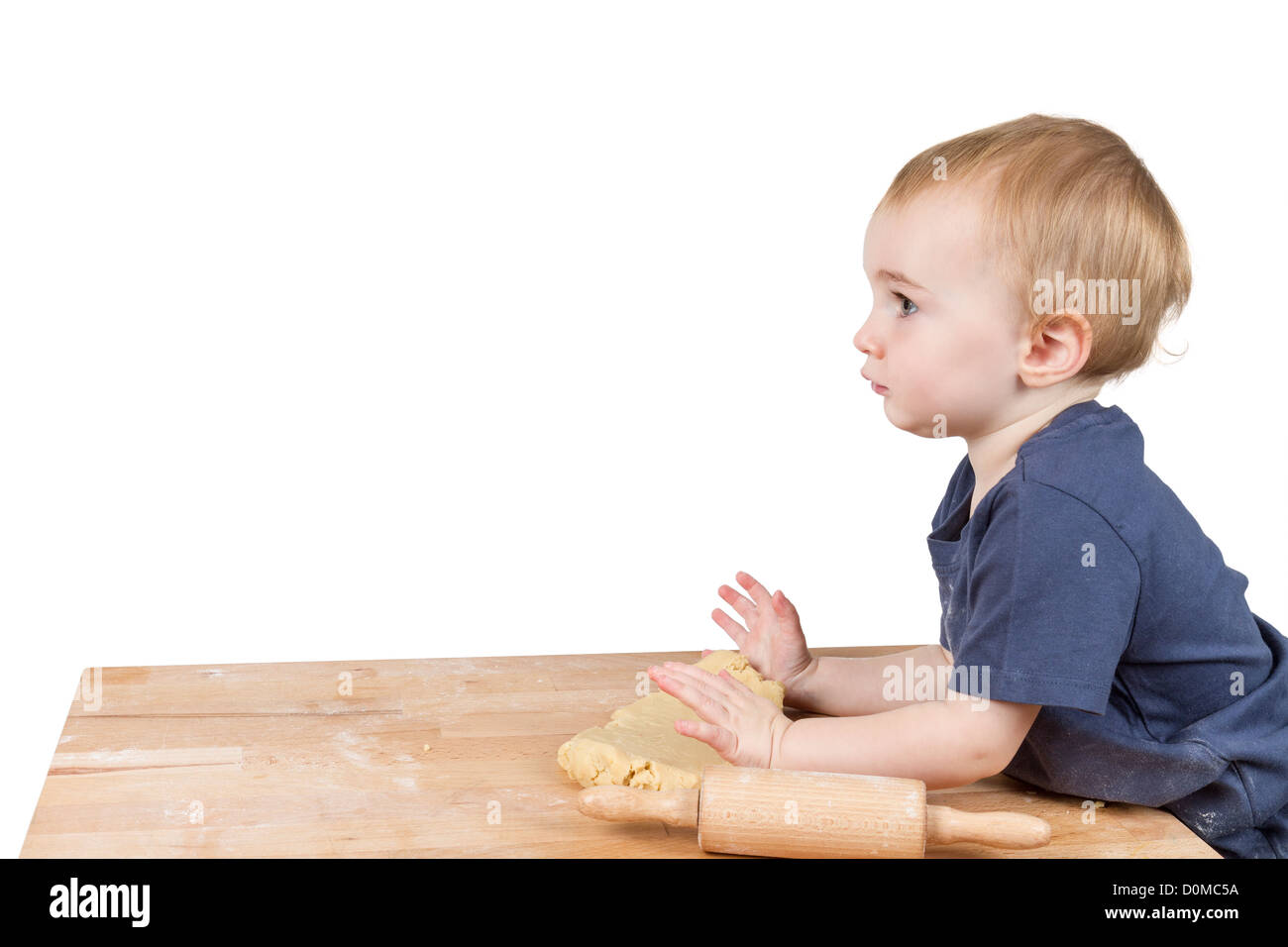 young child making cookies on small wooden desk Stock Photo - Alamy