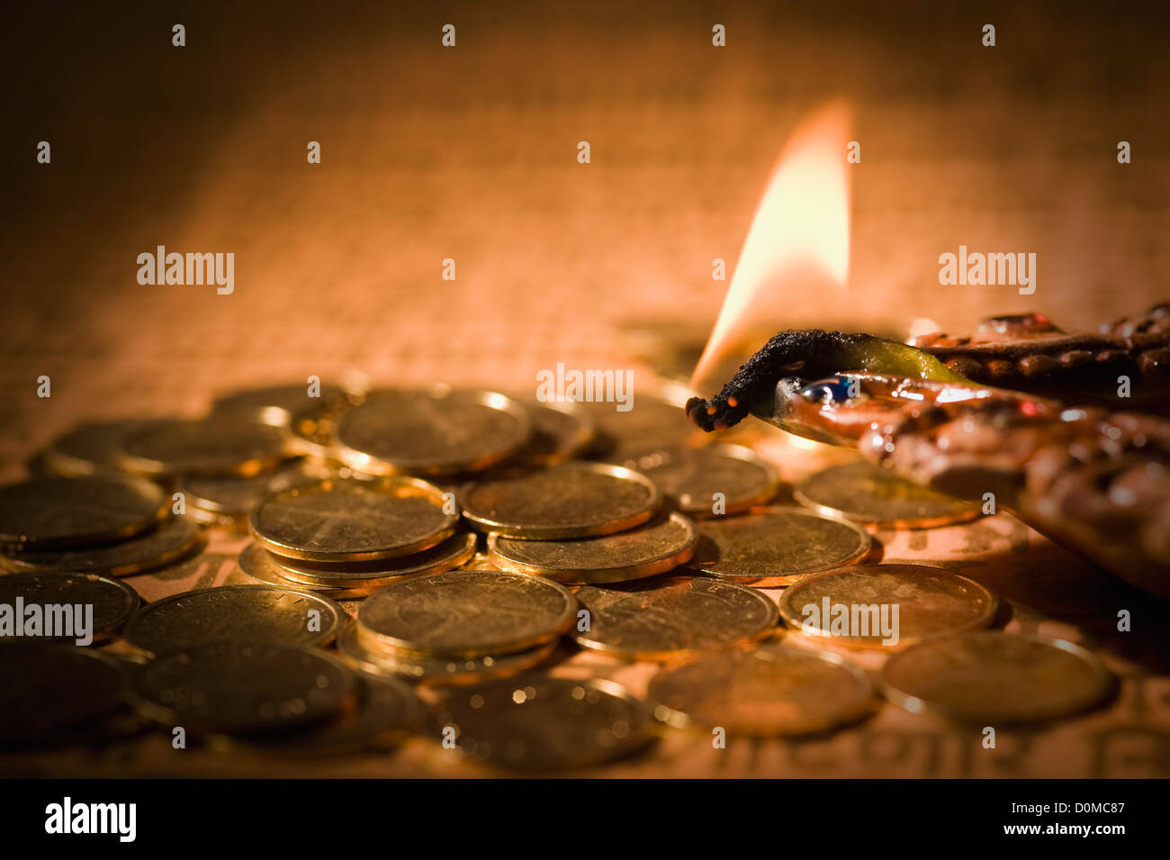 Indian coins with a Diwali oil lamp Stock Photo - Alamy