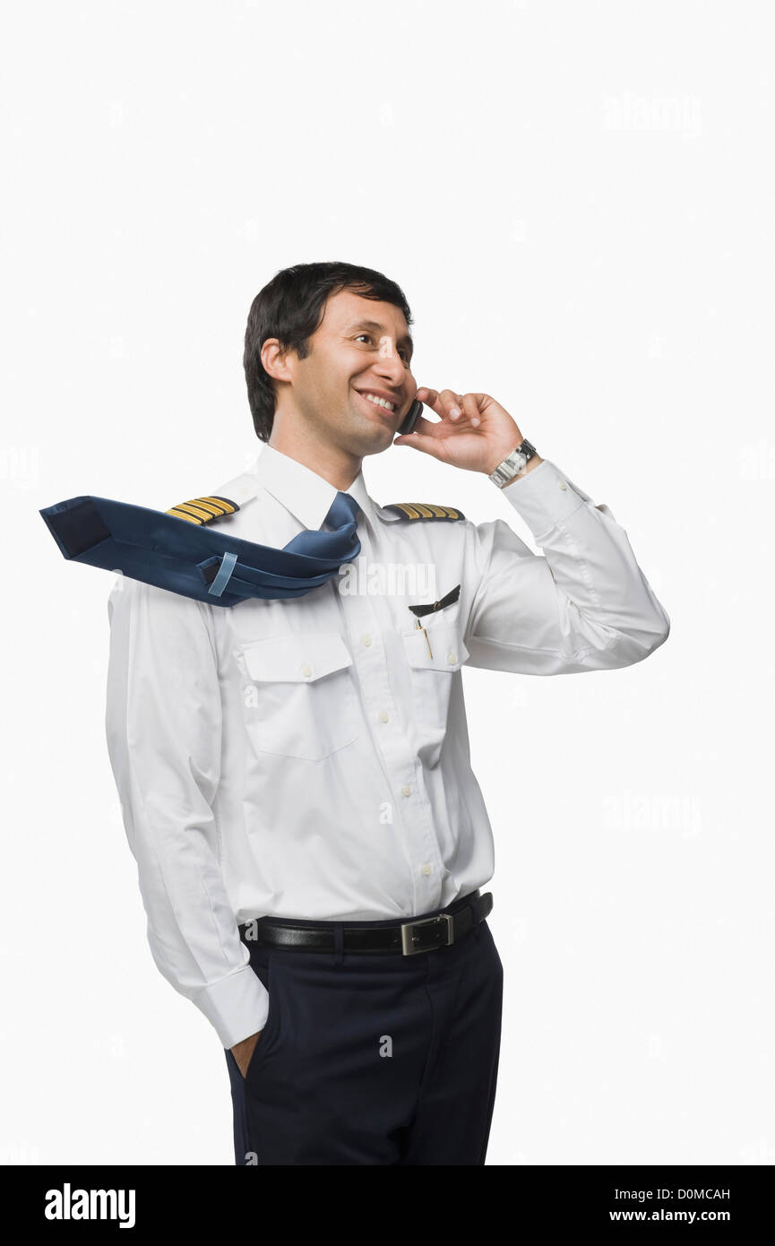 Pilot talking on a mobile phone Stock Photo - Alamy