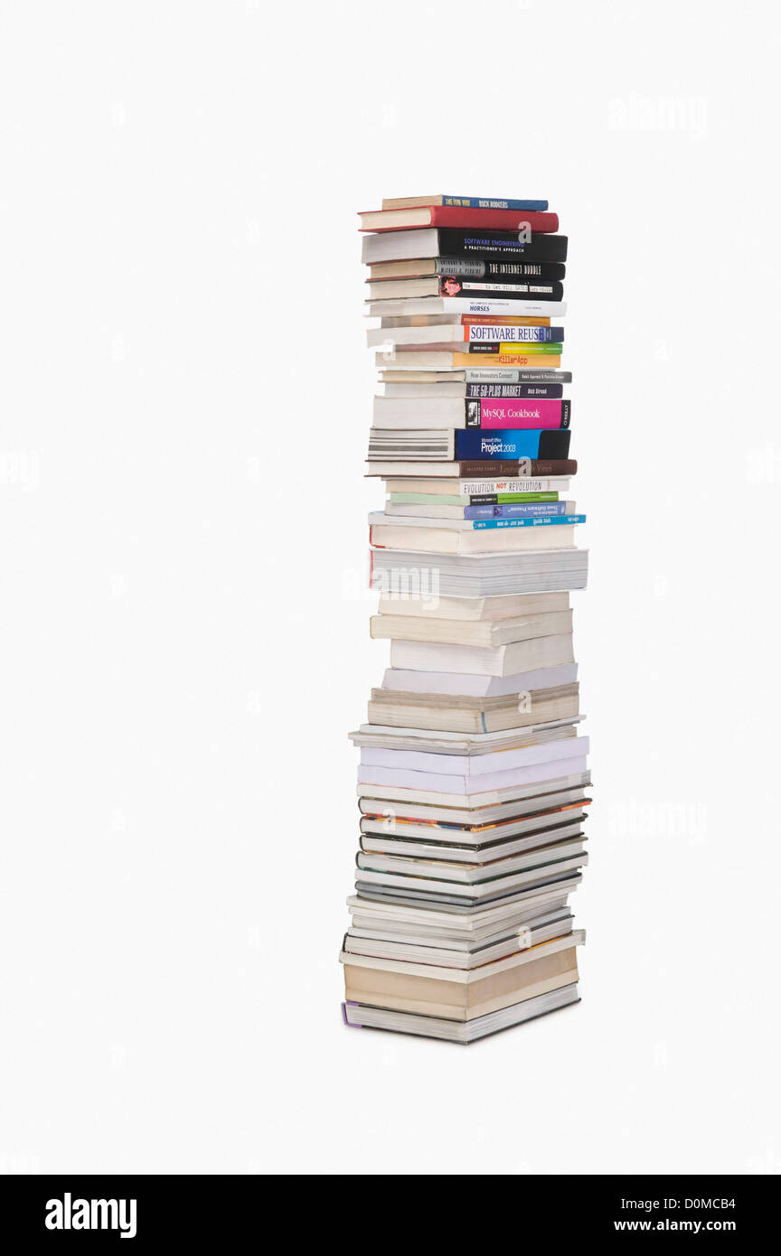 Stack of books against white background Stock Photo - Alamy