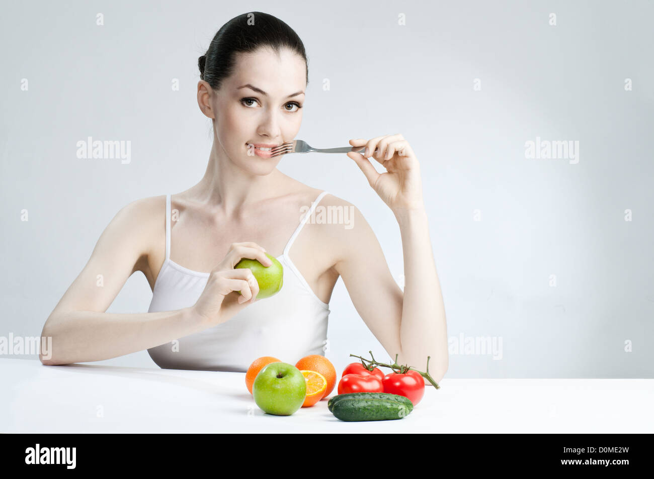 A beautiful slender girl eating healthy food Stock Photo - Alamy