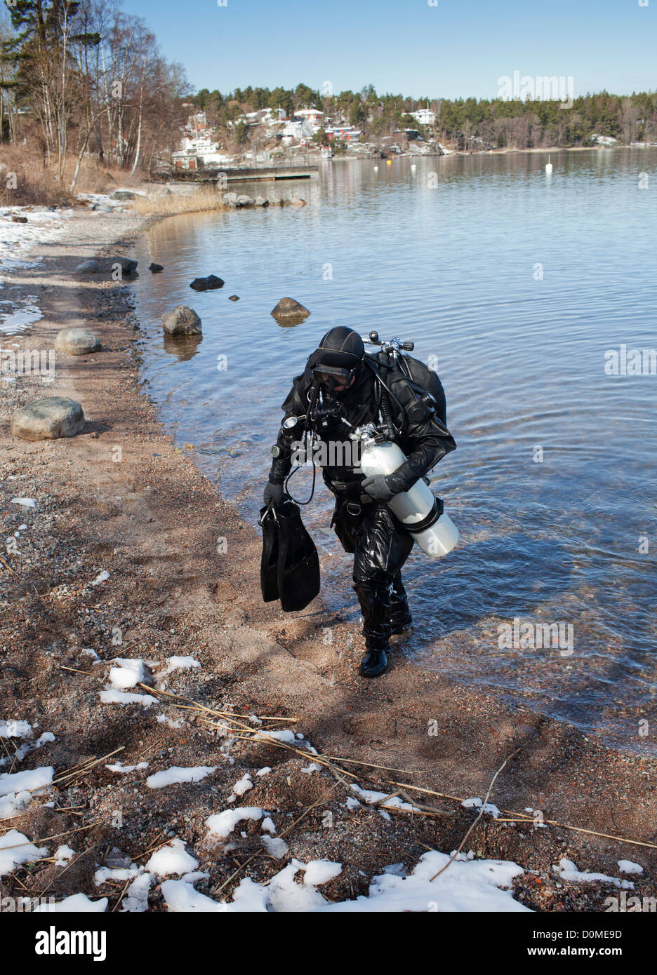 Diver walking out of water Stock Photo - Alamy