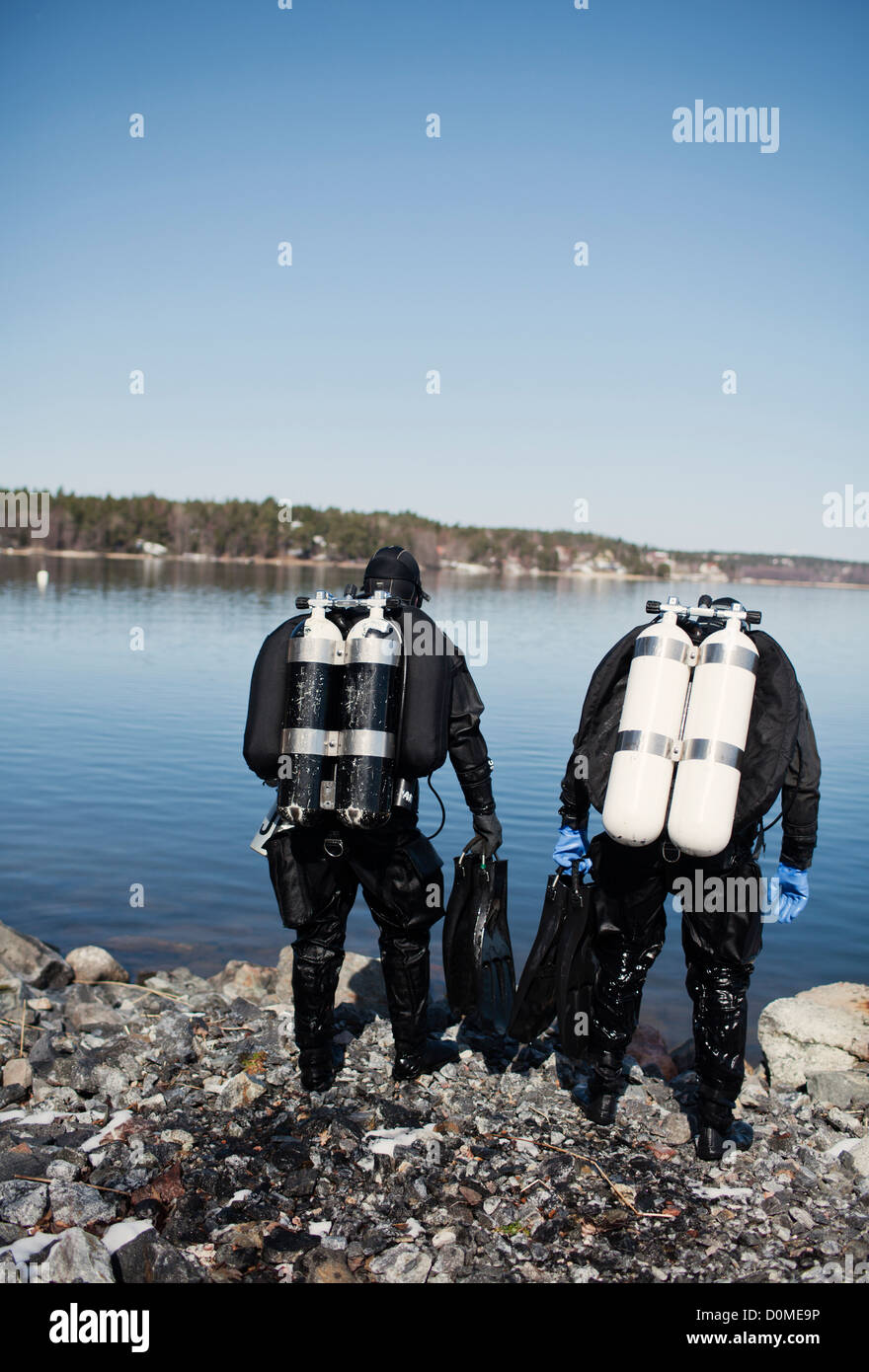 Two men preparing for diving Stock Photo - Alamy