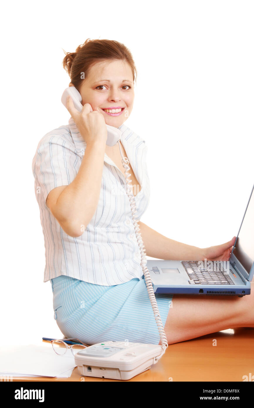 Woman sitting on table Stock Photo - Alamy