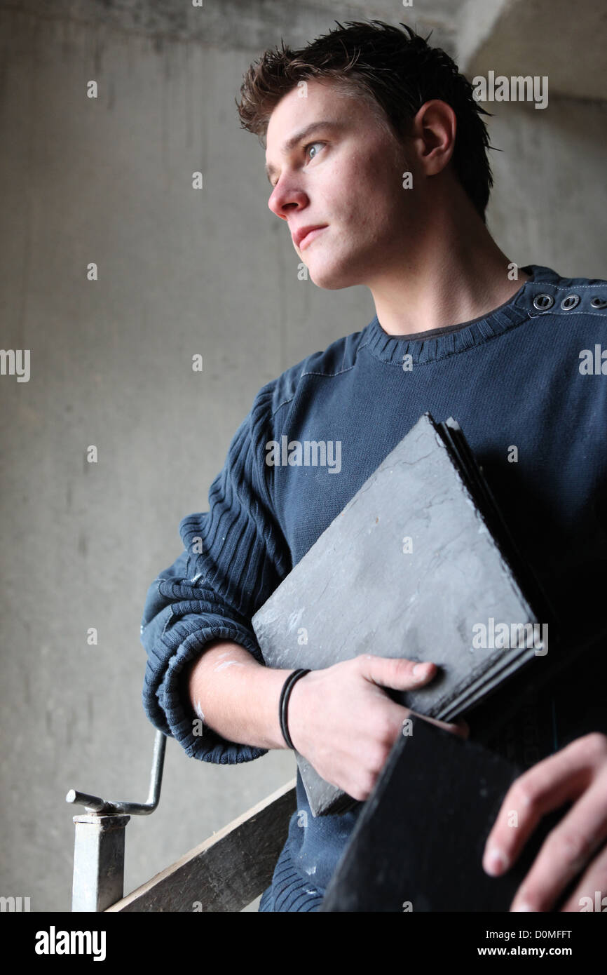 Contractor holding instruction manual Stock Photo - Alamy