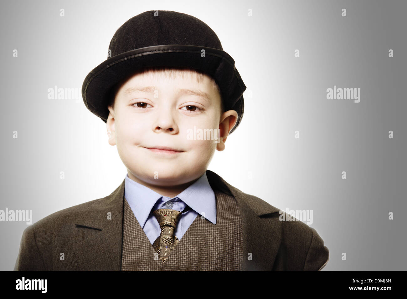 Funny boy in bowler hat Stock Photo - Alamy