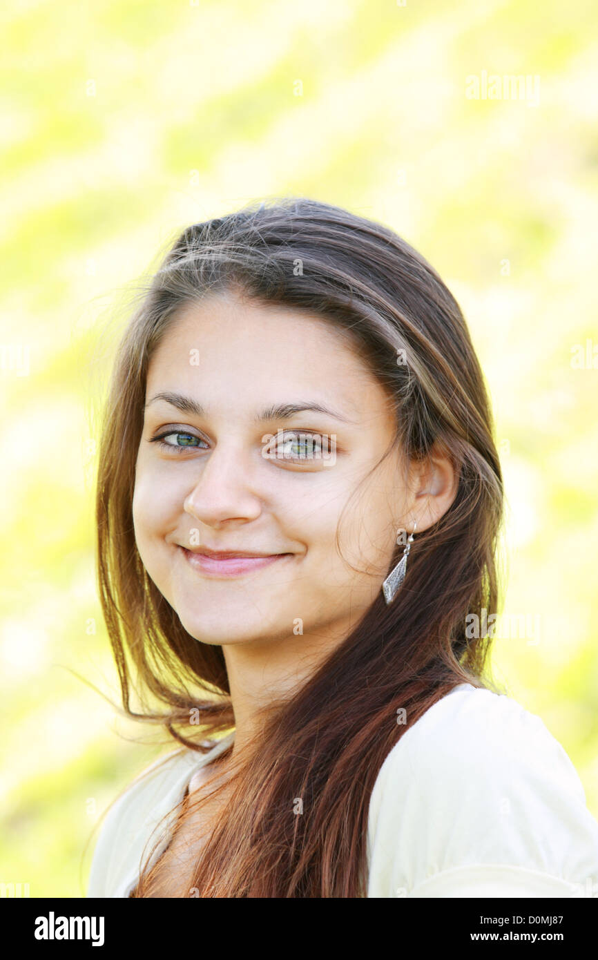 Smiling brunette girl with green eyes Stock Photo - Alamy