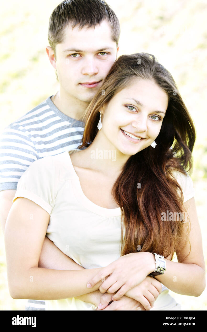 Serious guy and smiling girl Stock Photo - Alamy