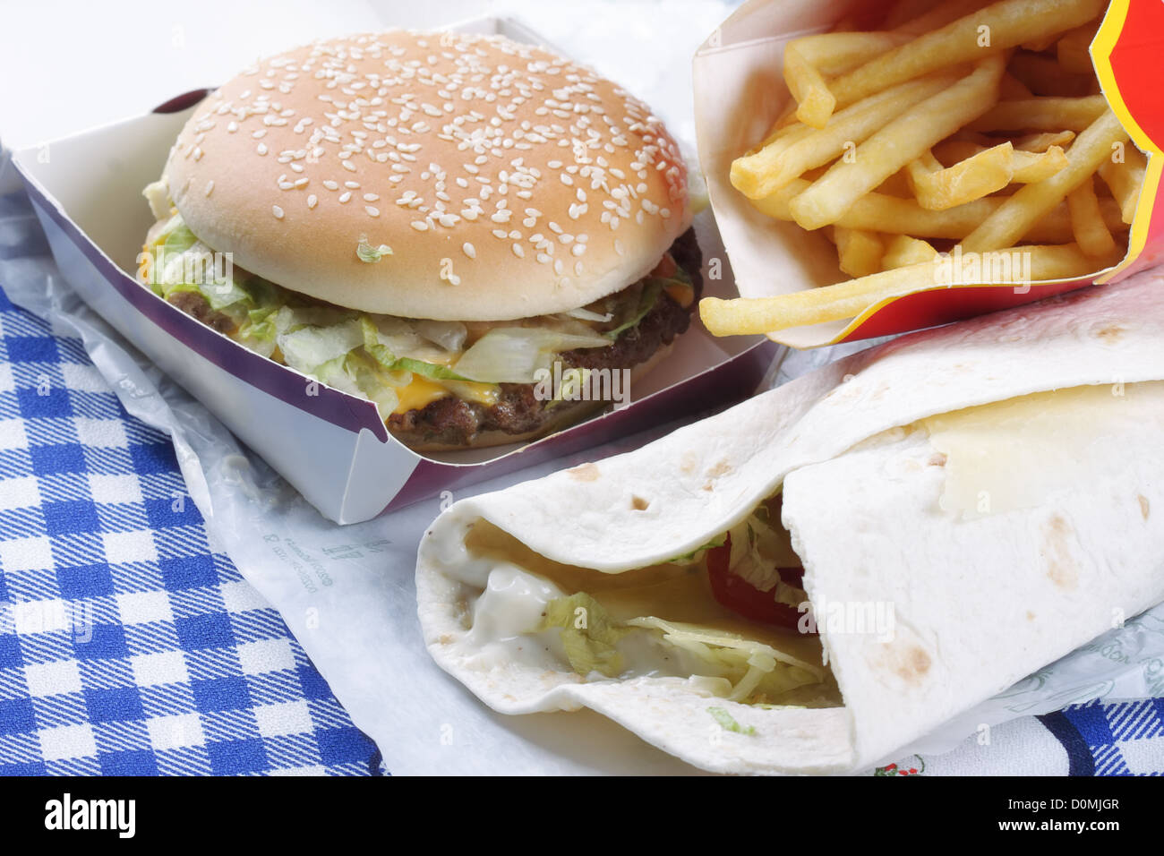 Various junk food on table Stock Photo - Alamy