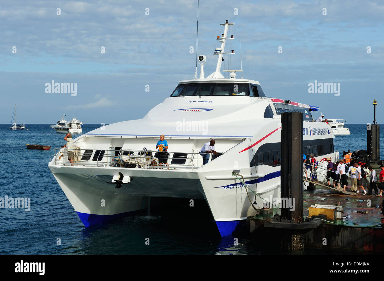 Passengers embarking on ferry at Stone Town, Zanzibar, Tanzania, East ...