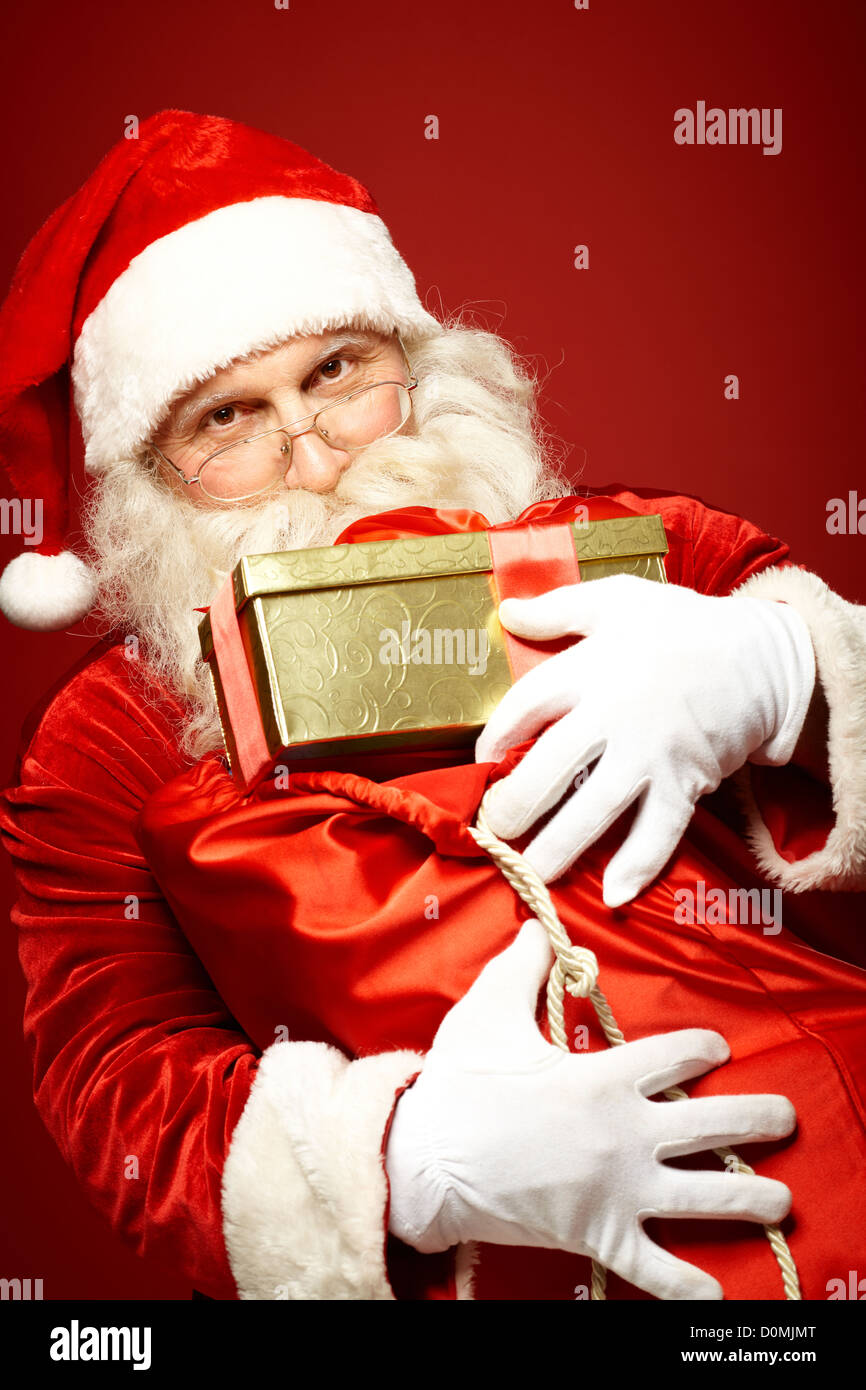 Portrait of Santa Claus with big red sack full of gifts Stock Photo - Alamy
