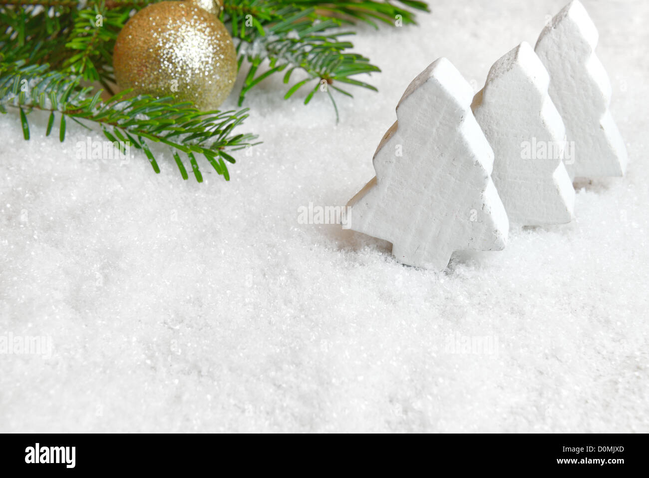 Golden Ball, fir branch and trees in the snow Stock Photo - Alamy