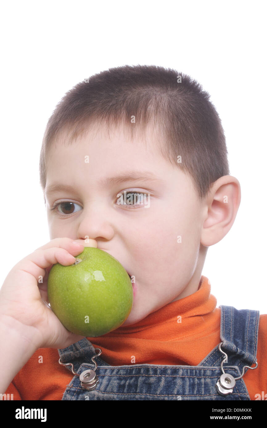 Kid biting apple Stock Photo - Alamy