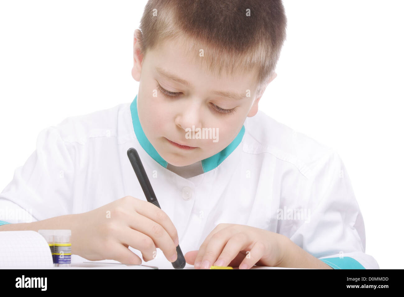 Boy examining object in lab Stock Photo - Alamy