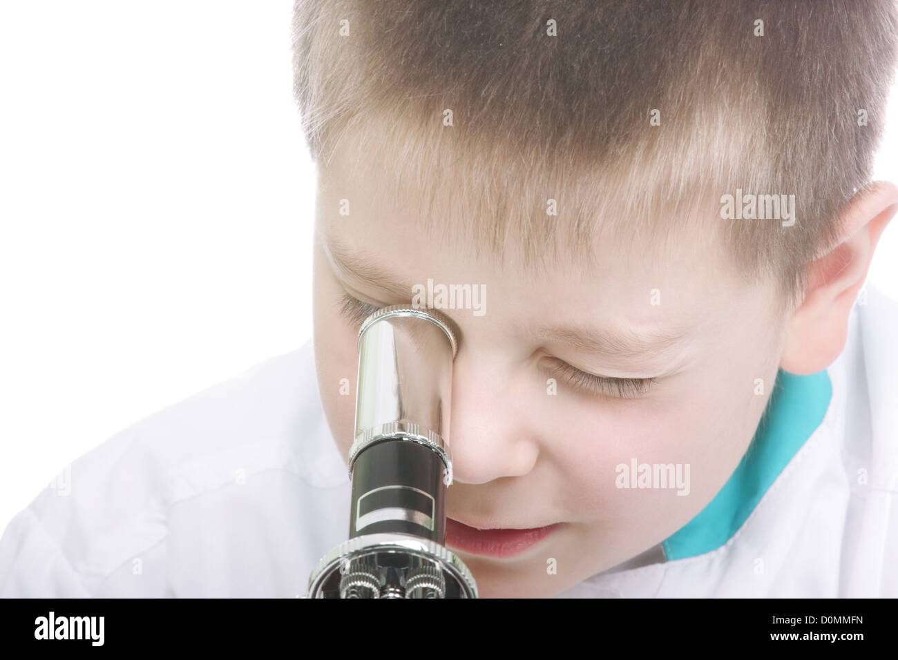 Kid looking into microscope closeup Stock Photo - Alamy