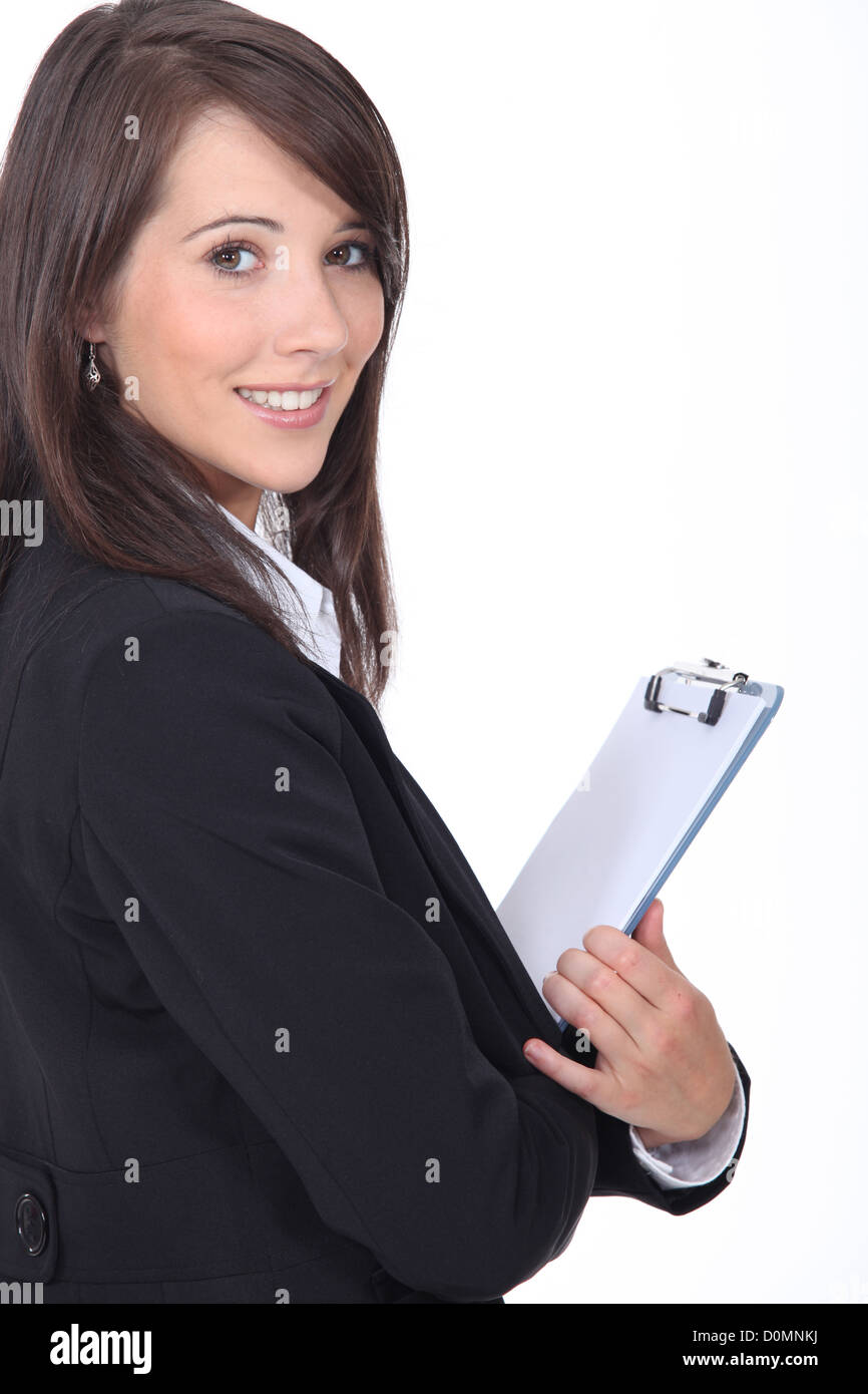 Young woman holding notepad Stock Photo - Alamy