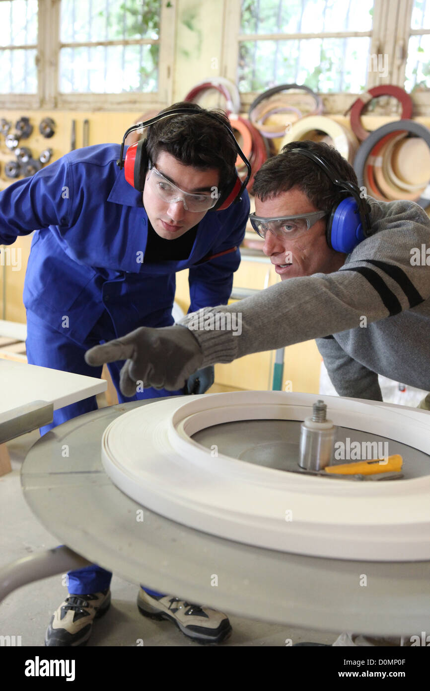 Men working in a factory Stock Photo - Alamy