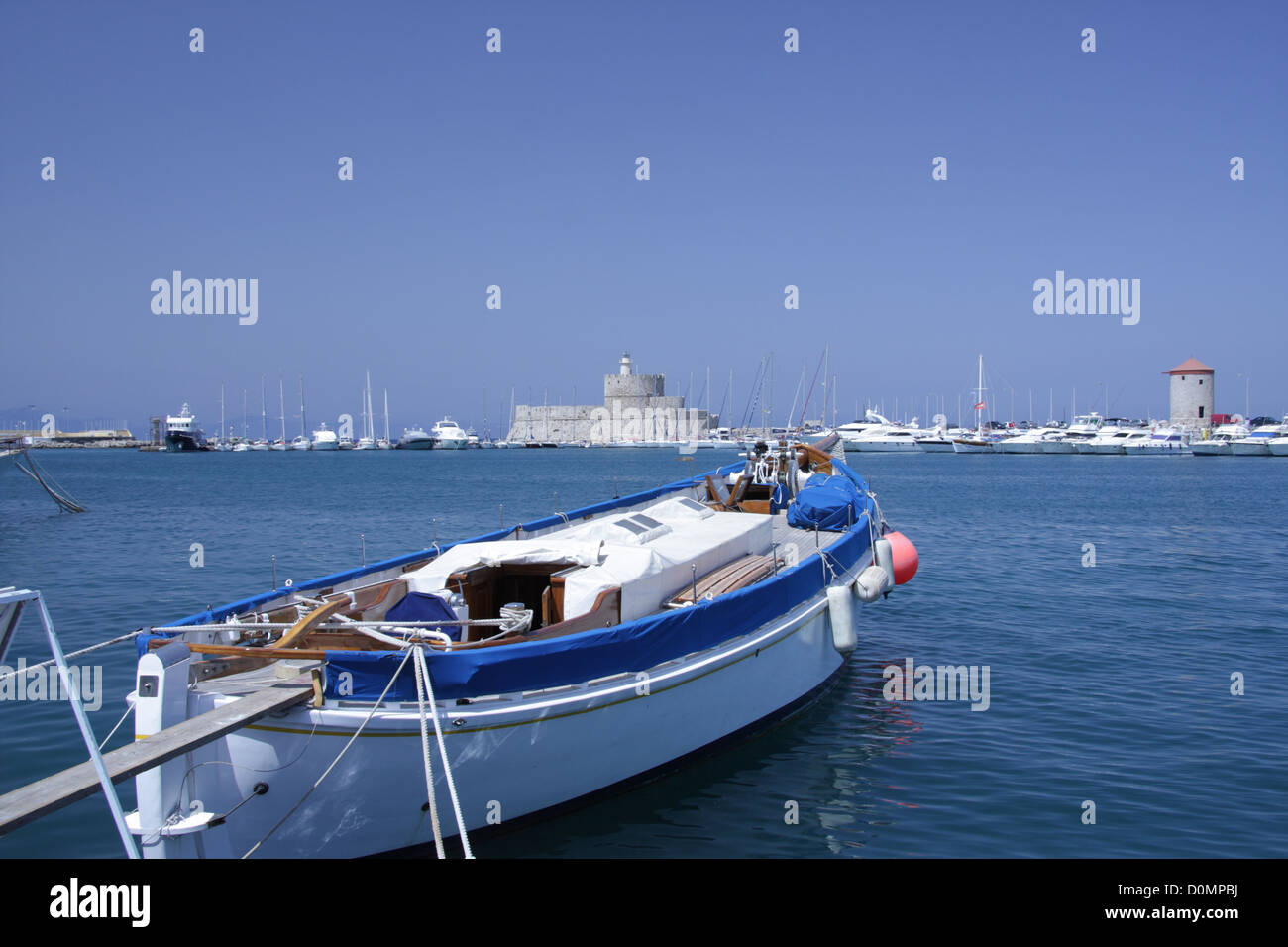 Boat in Rhodes harbour Stock Photo - Alamy