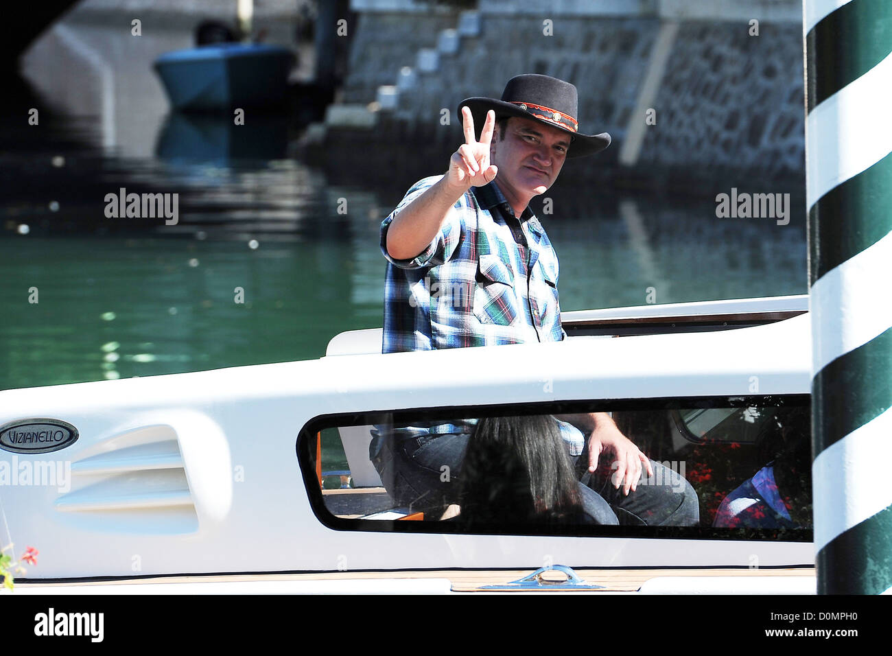 Quentin Tarantino boards a water taxi at the Excelsior Hotel ahead of ...