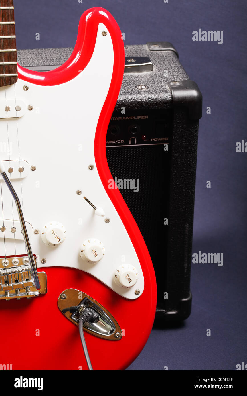 Red guitar on amplifier Stock Photo - Alamy