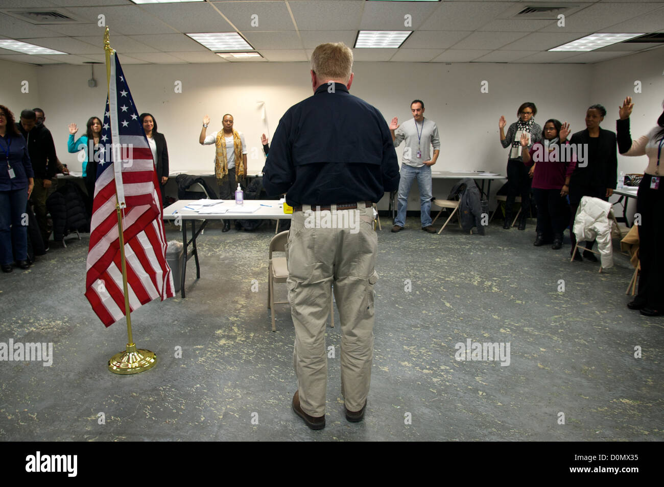 FEMA Federal Coordinating Officer Michael Byrnes administers the oath ...