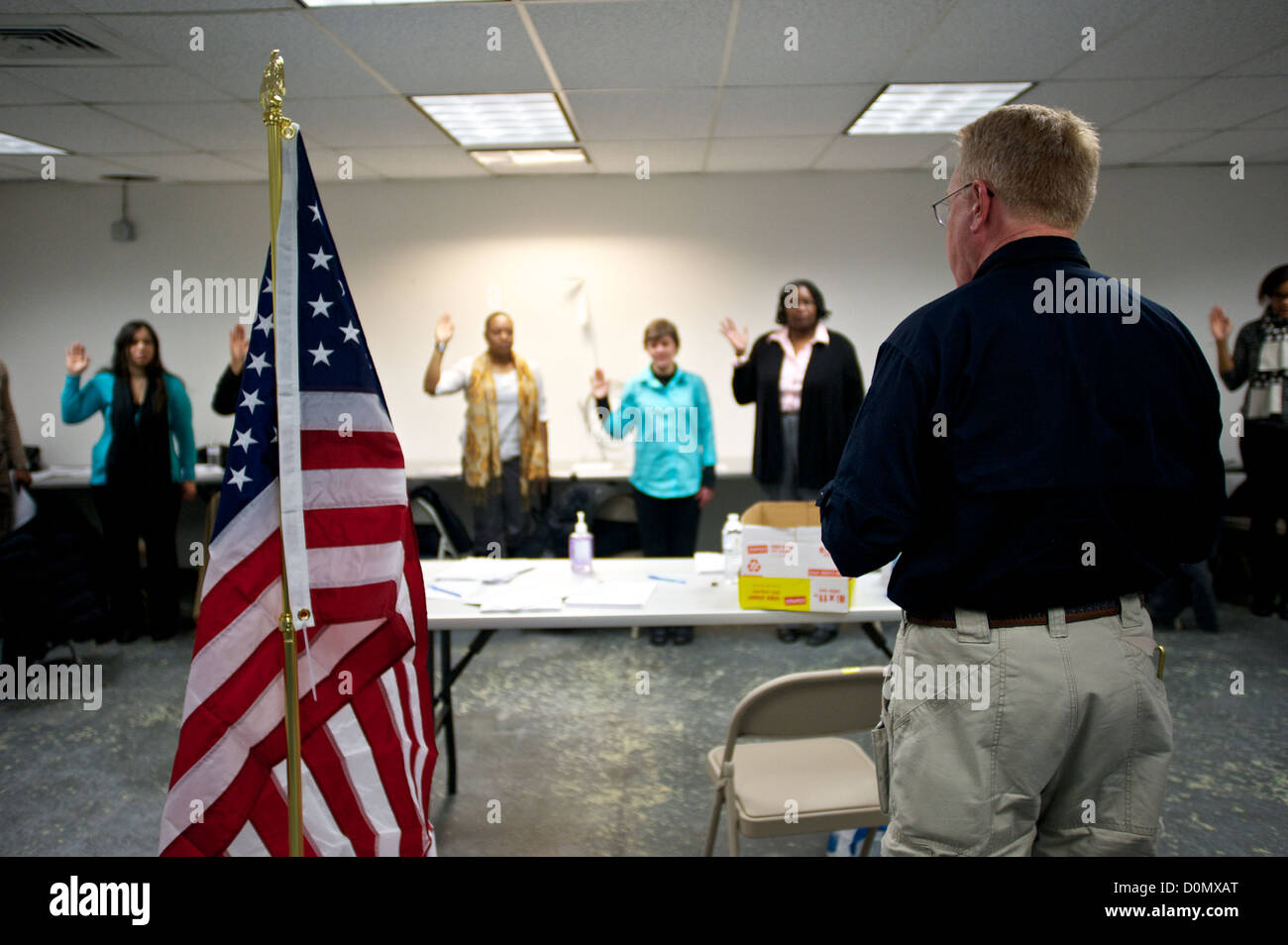 FEMA Federal Coordinating Officer Michael Byrnes administers the oath ...
