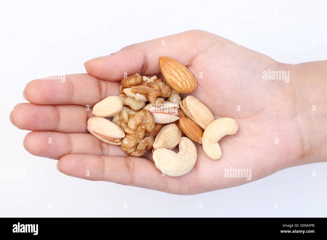 Cashew nuts in hand hi-res stock photography and images - Alamy