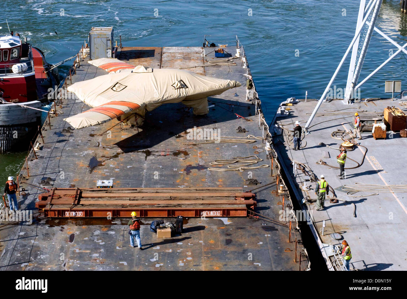 Contractors hoist the X-47B Unmanned Combat Air System (UCAS ...