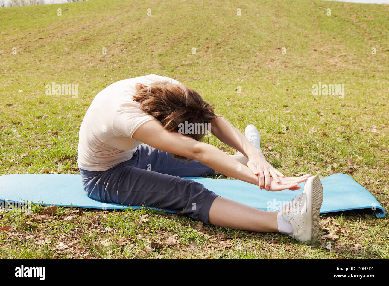 Bending forward sideview Stock Photo - Alamy