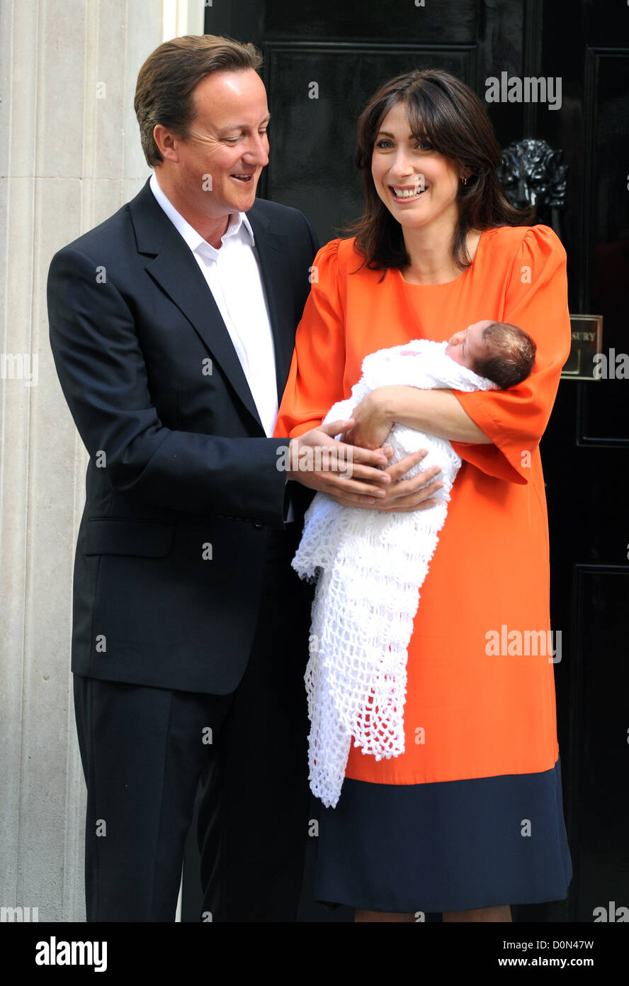 Prime Minister David Cameron returns to 10 Downing Street with his wife ...