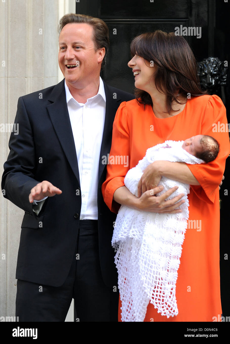 Prime Minister David Cameron returns to 10 Downing Street with his wife ...