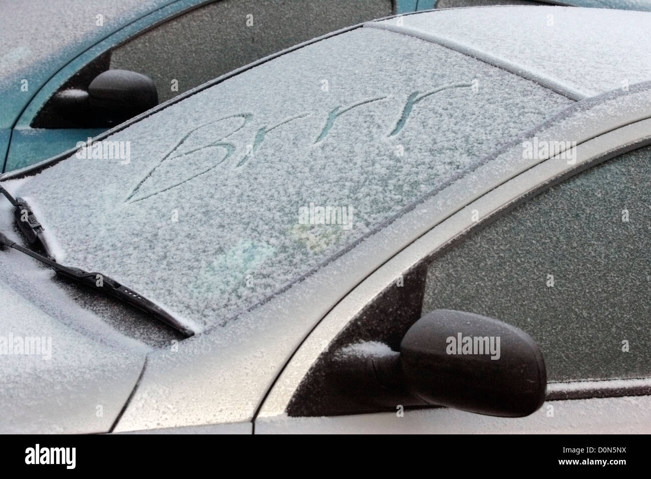 Ice on car windscreen with writing Stock Photo - Alamy