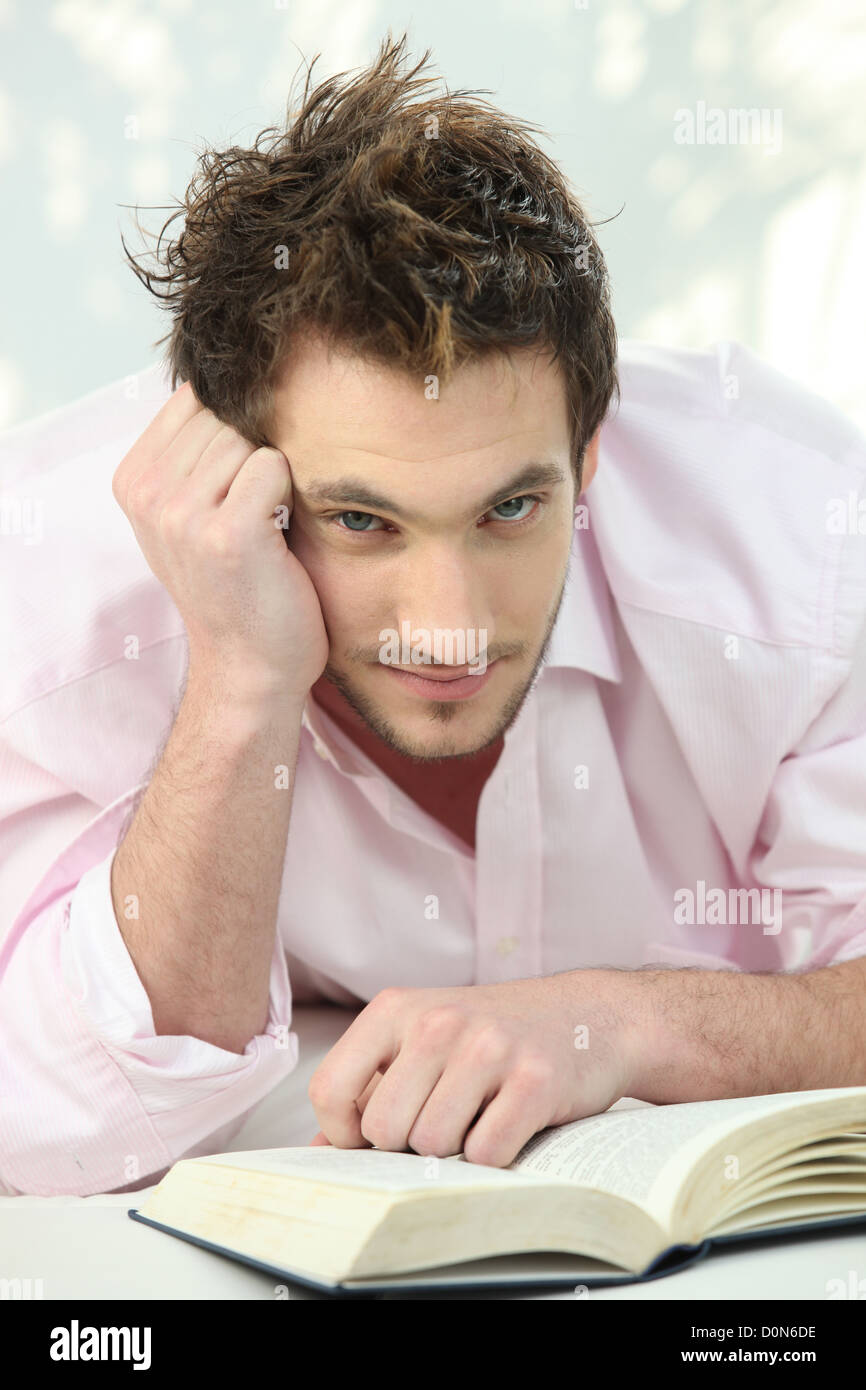 Man at home with a book Stock Photo - Alamy