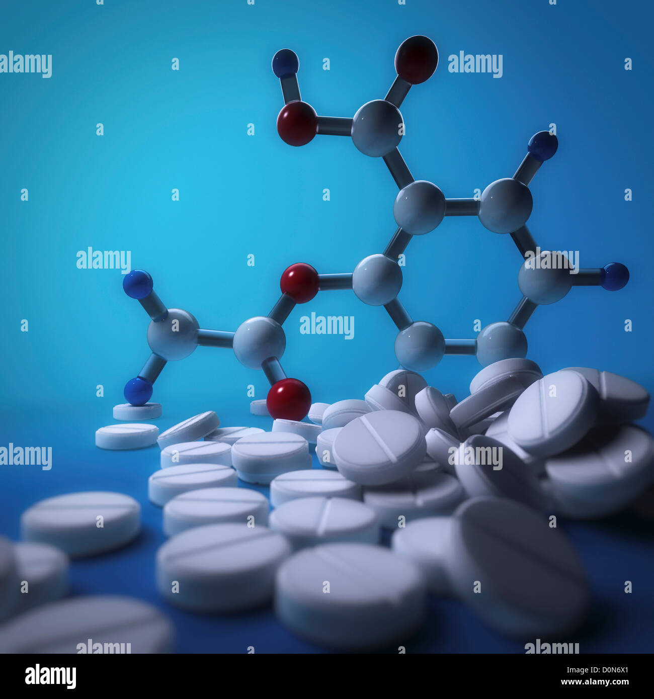 Aspirin or acetylsalicylic acid molecular model next to a pile of ...