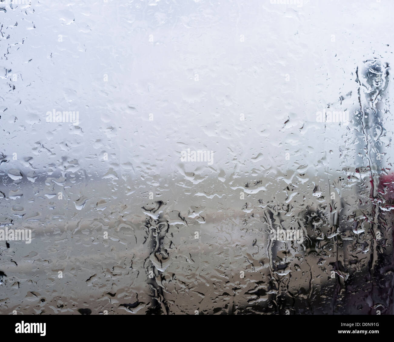 Rain drops on a window looking out to sea Stock Photo - Alamy