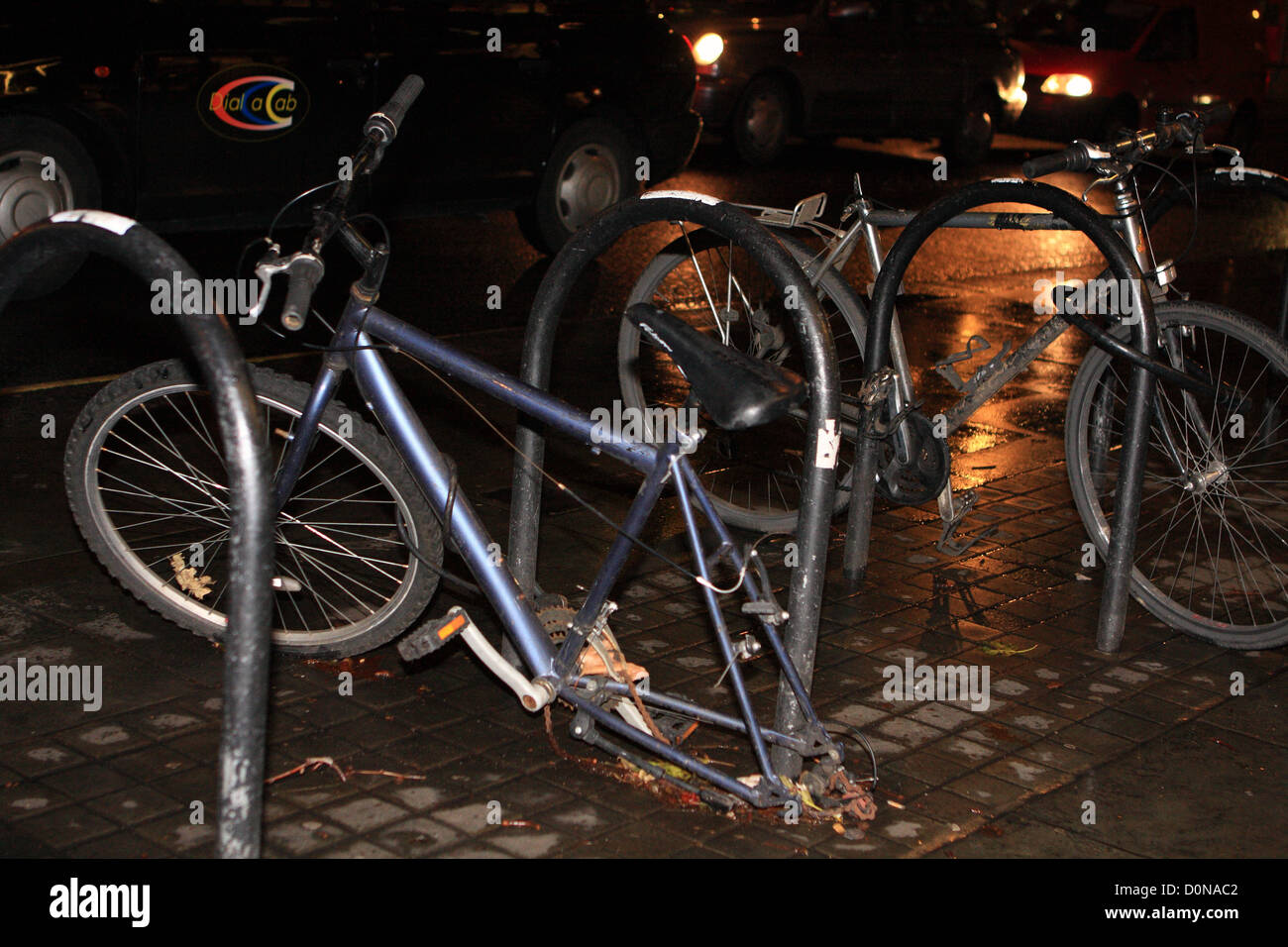 A vandalised bike still chained to a cycle rack Stock Photo - Alamy