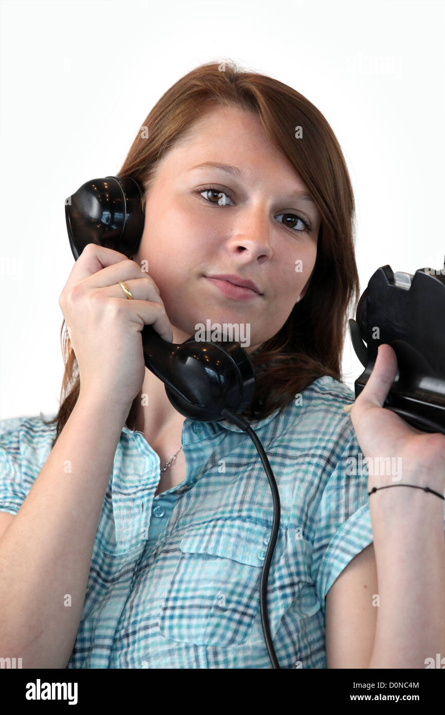Young woman speaking on the phone Stock Photo - Alamy